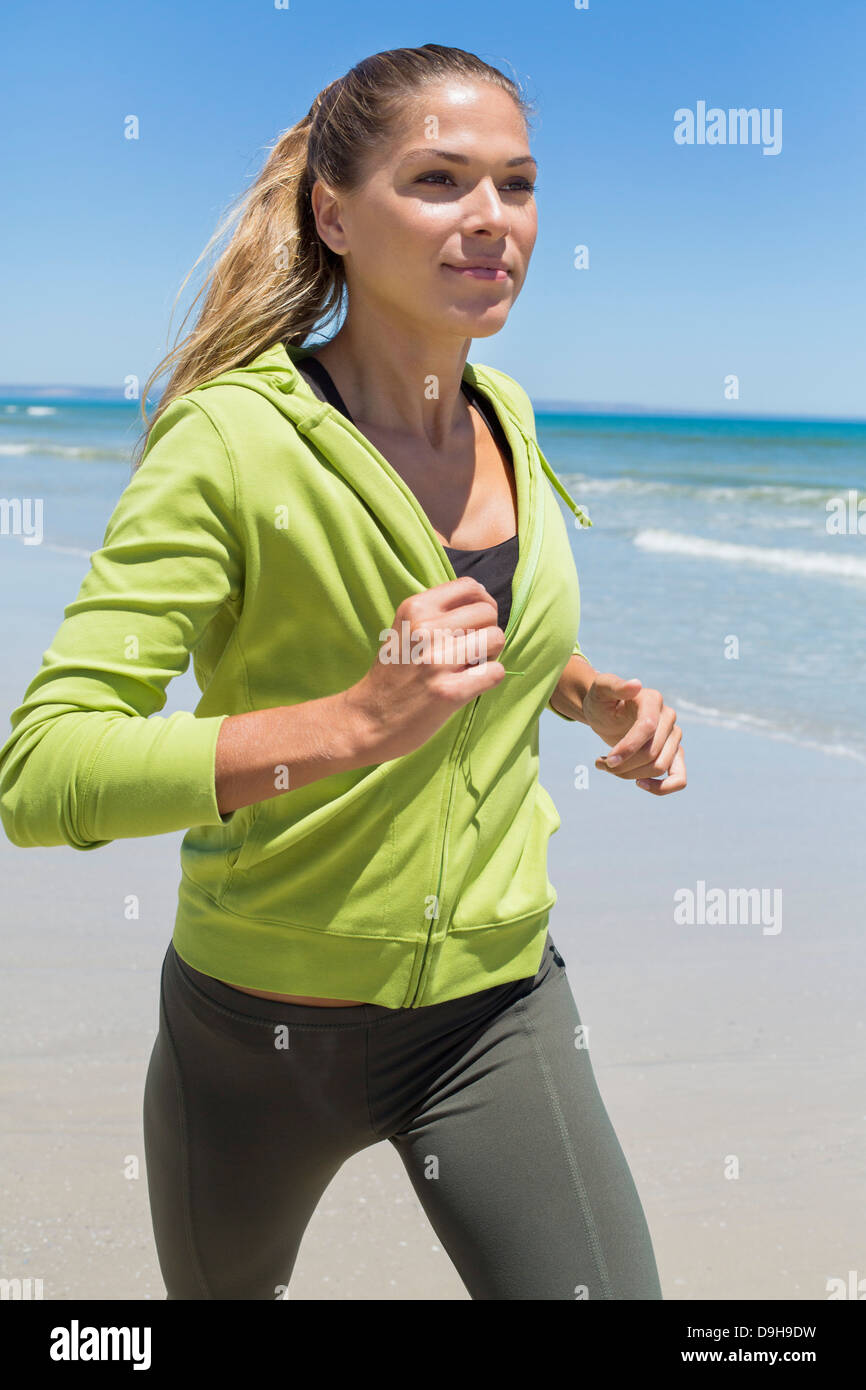 Woman jogging on the beach Stock Photo - Alamy