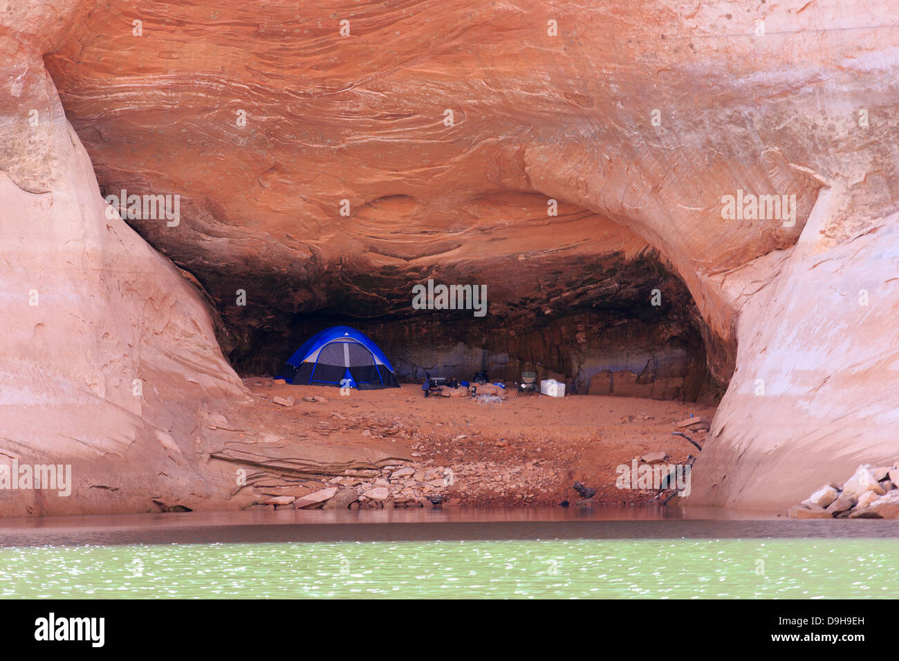 A campsite in a cave at Moki Canyon in Lake Powell, Utah Stock Photo ...