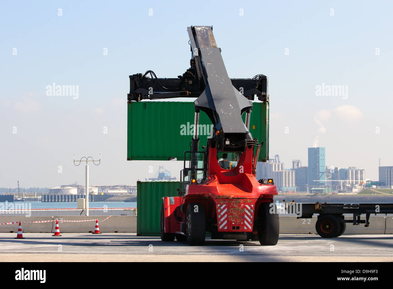 Mobile container handler in action at a container terminal Stock Photo ...