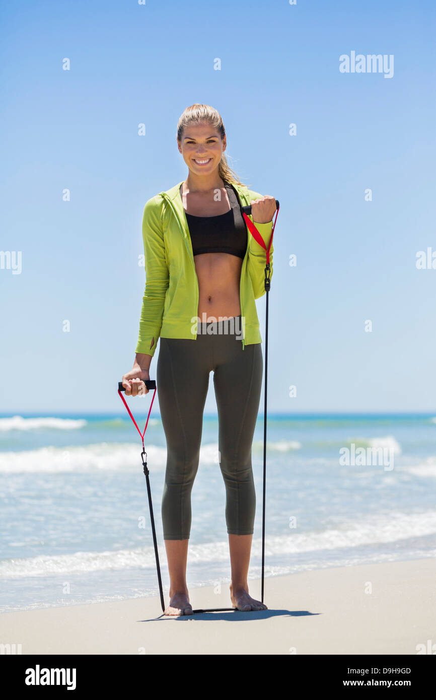Woman exercising chest expander hi-res stock photography and images - Alamy