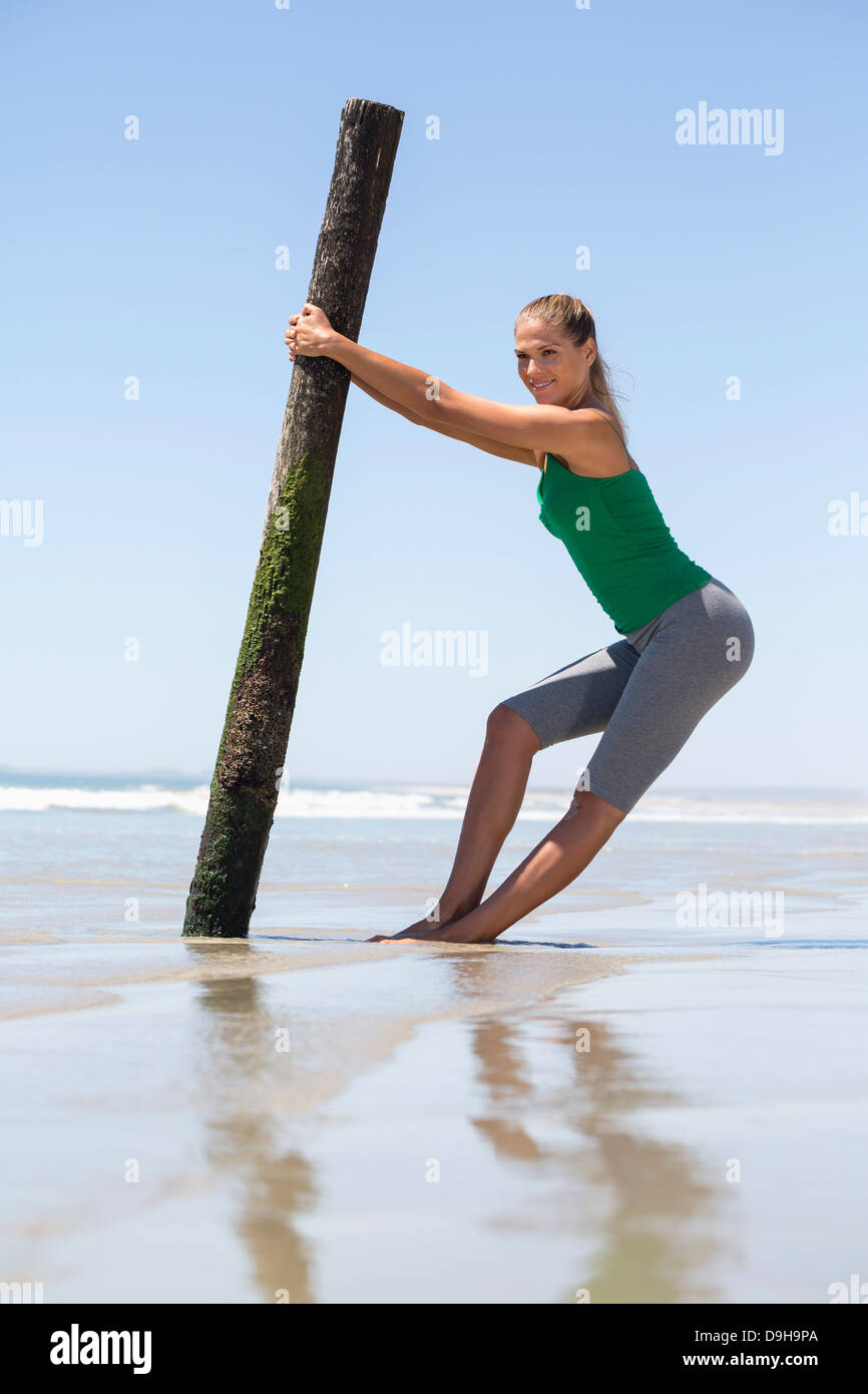 Woman holding pole on beach hi-res stock photography and images - Alamy