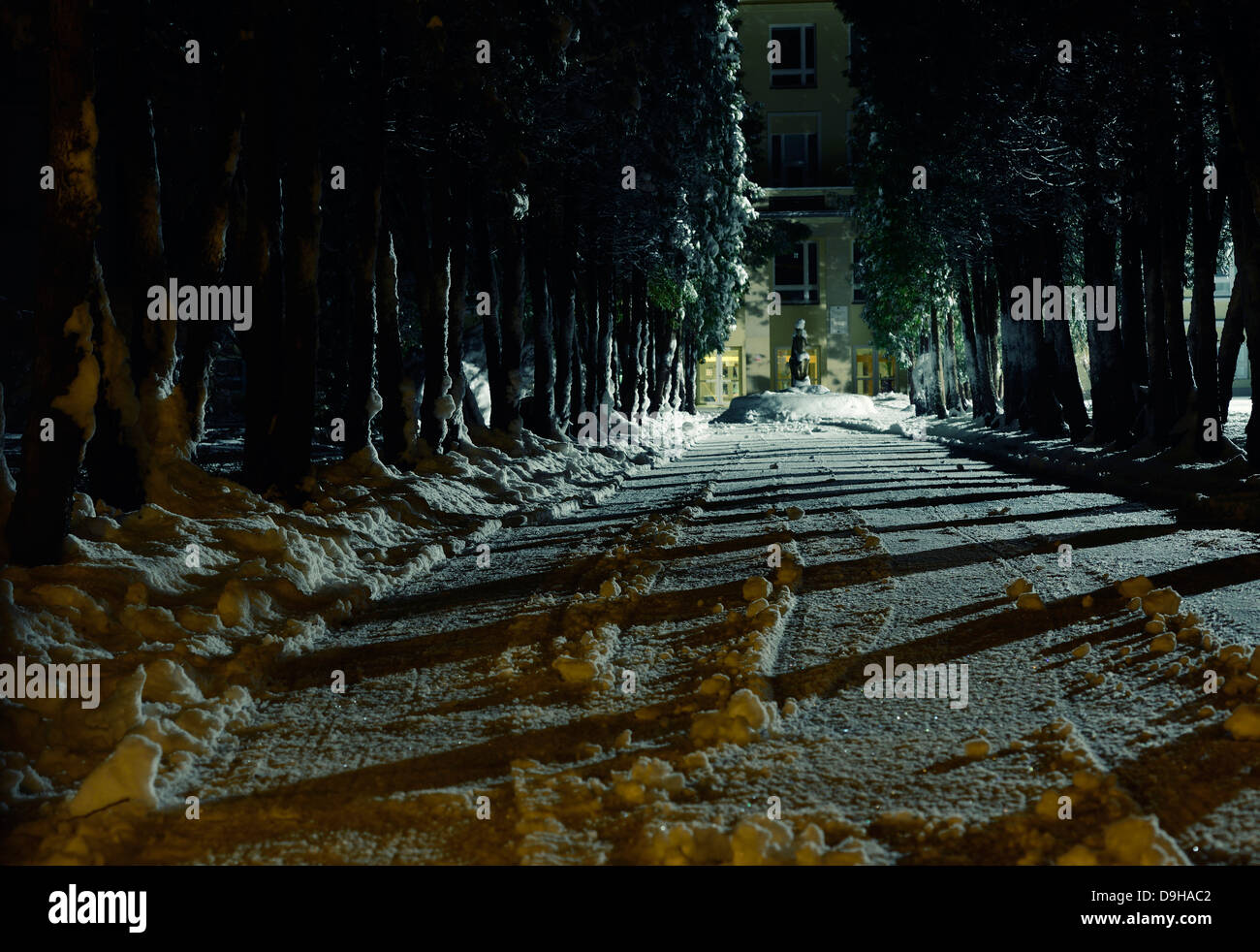 Snowy alleyway at night Stock Photo - Alamy