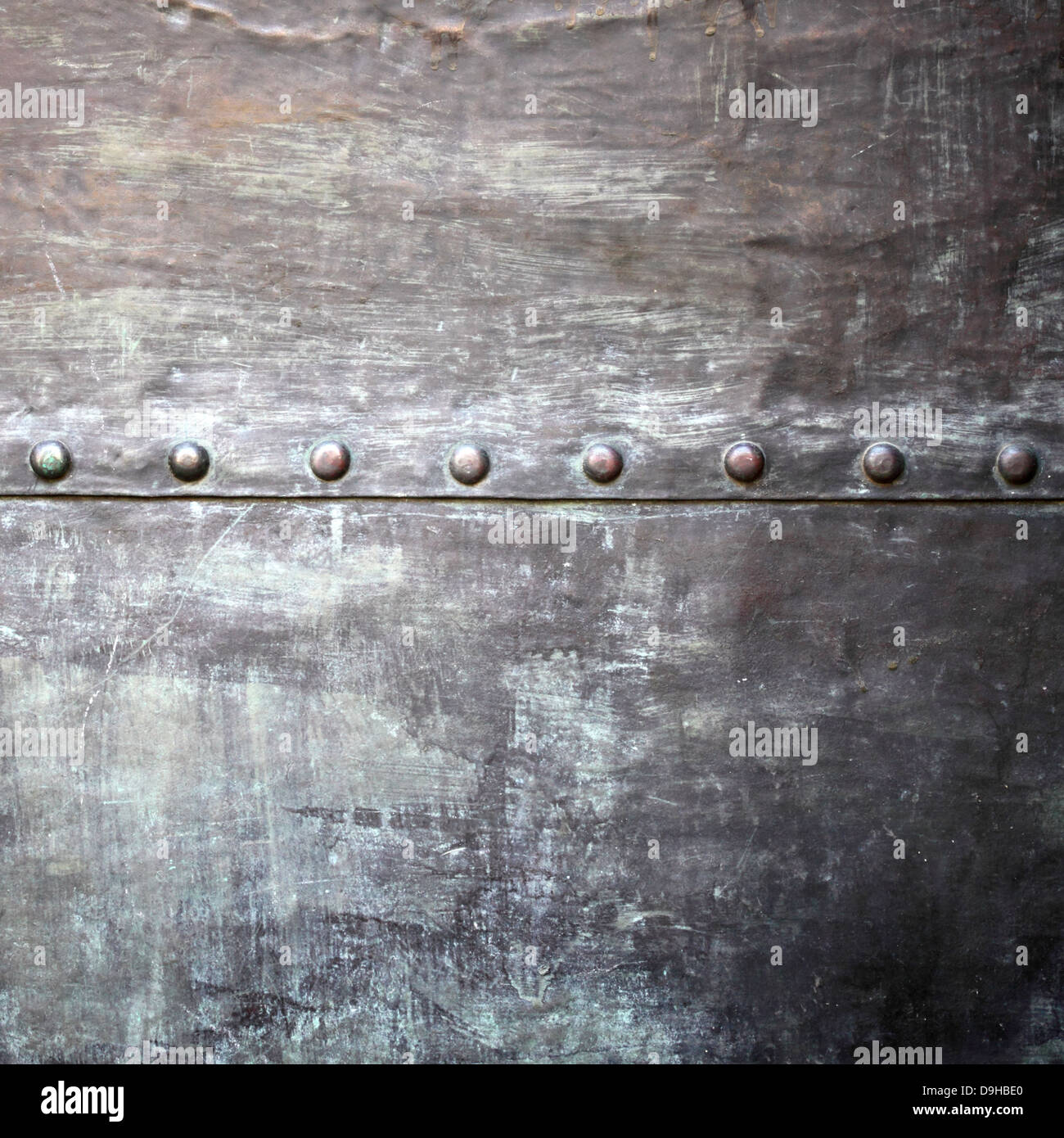 Black grunge metal plate or armour texture with rivets as background ...