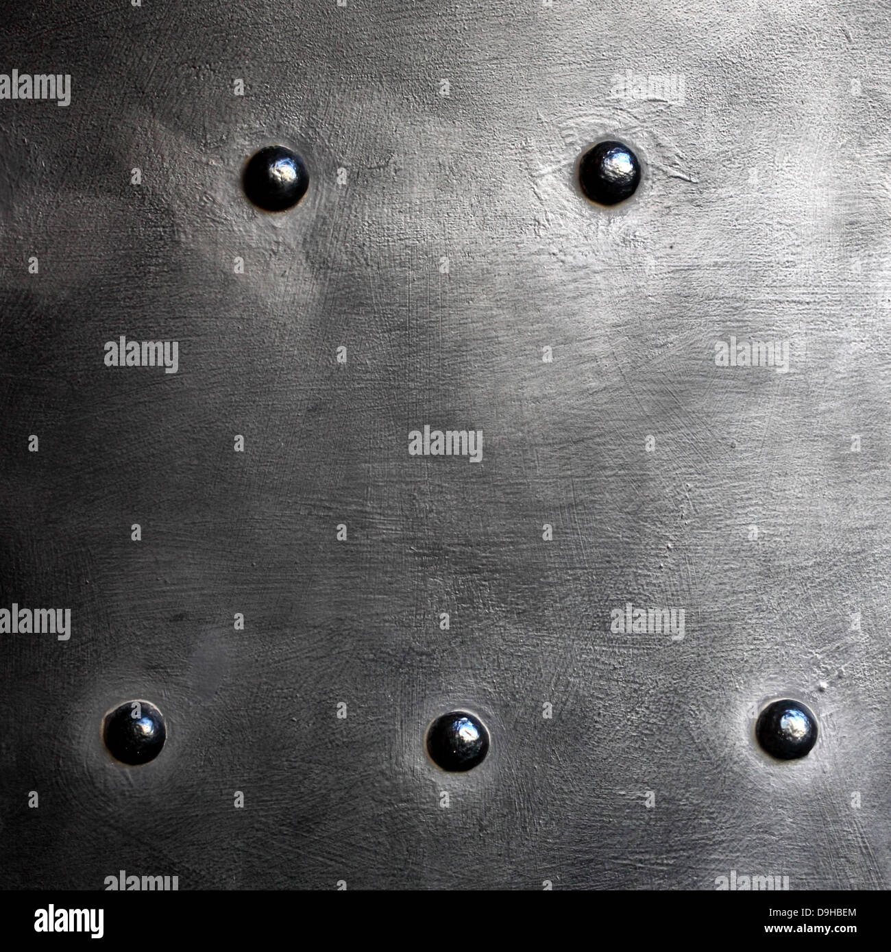 Black grunge metal plate or armour texture with rivets as background ...