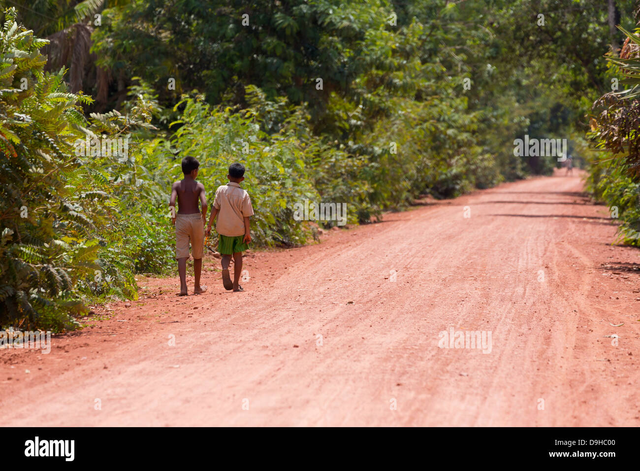 Little Boys walking on a typical dusty Country Road in the Kampot ...