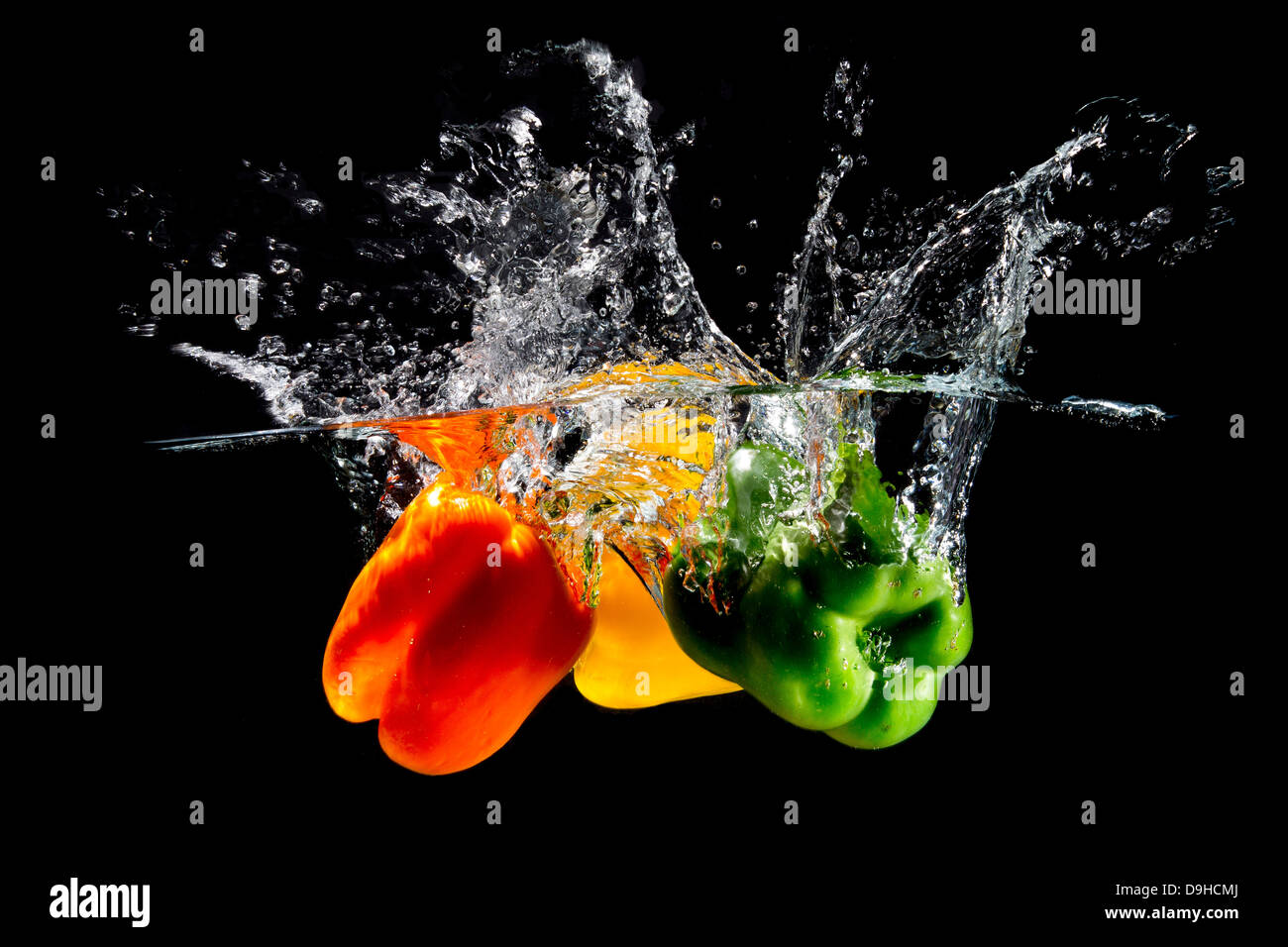 Green bell pepper splashing water hi-res stock photography and images ...