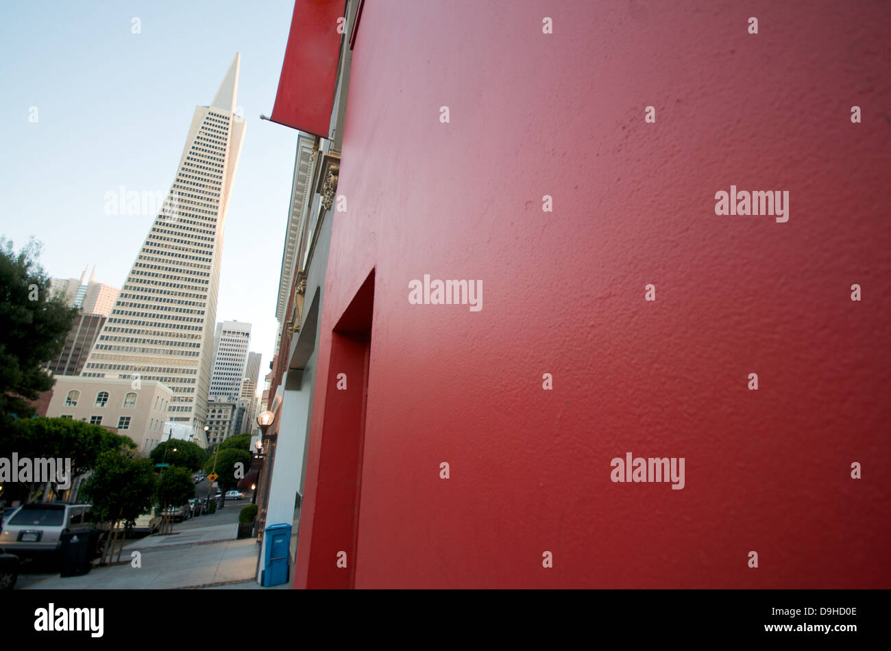 Transamerica with Transamerica Tower next to a red facade Stock Photo ...