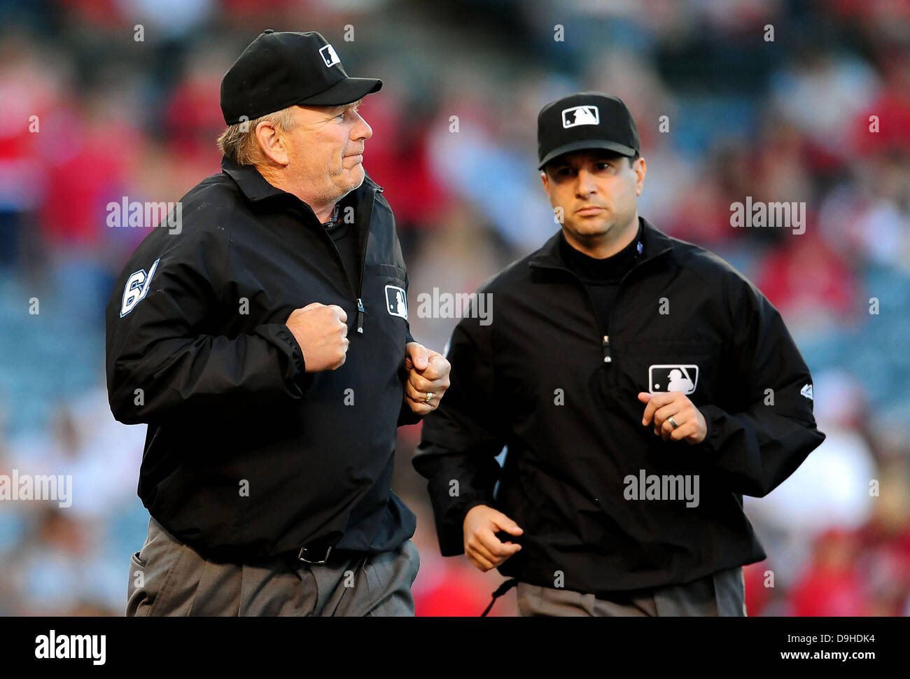 Anaheim, CA, USA. 19th June, 2013. Umpire Bob Davidson (61) and umpire ...