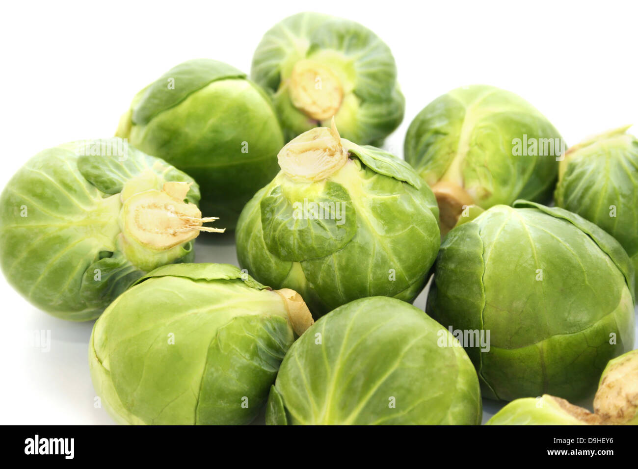 Green brussels sprouts on white background Stock Photo - Alamy