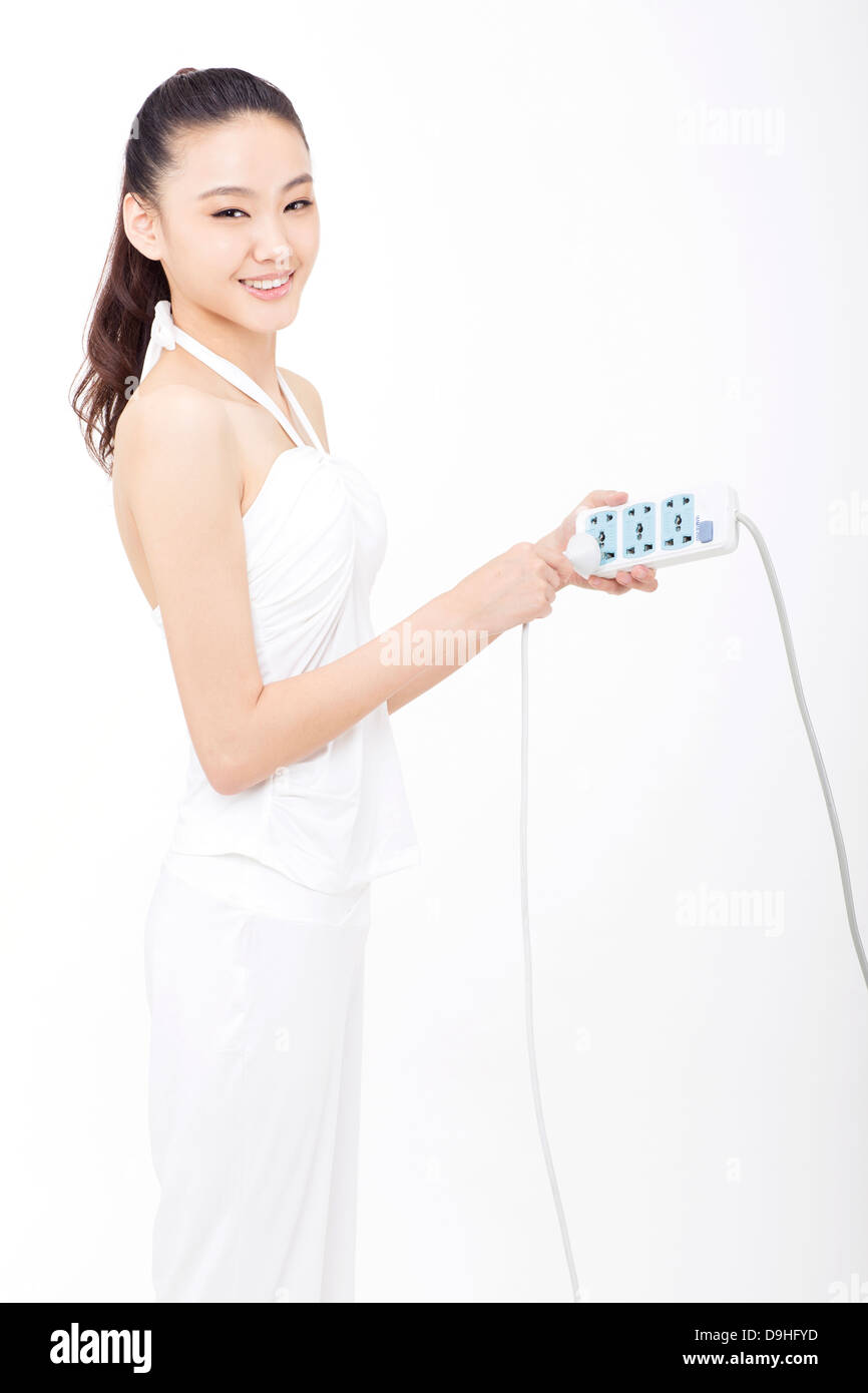 Young woman holding a socket Stock Photo - Alamy