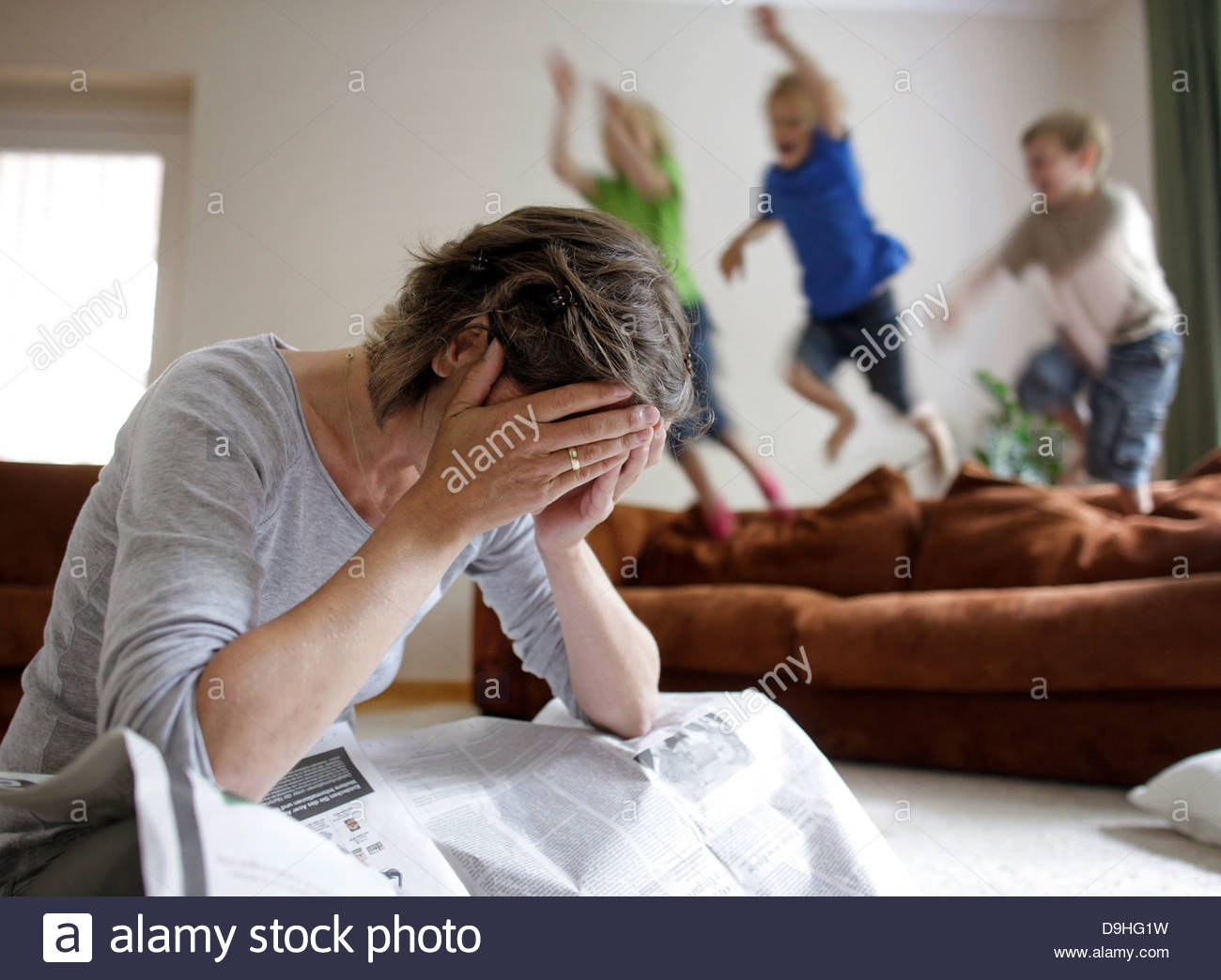 Frustrated Woman Children Playing In Stock Photos & Frustrated Woman ...