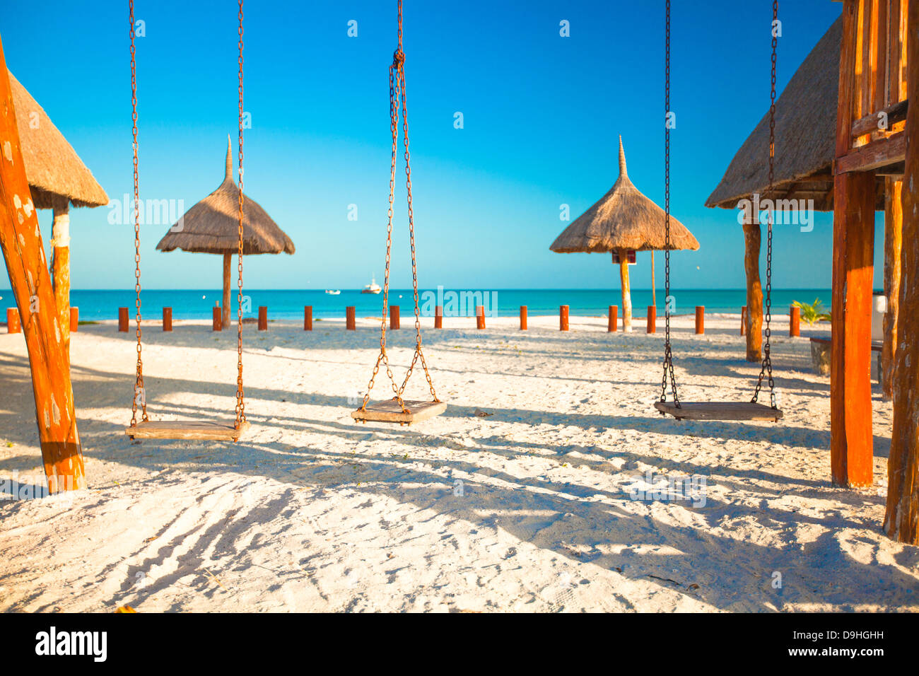 Triple swing on the beach on an exotic resort Stock Photo - Alamy