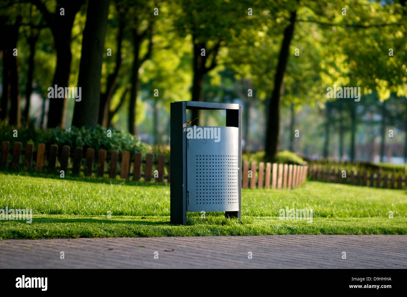 Clean green environment with trash can Stock Photo - Alamy