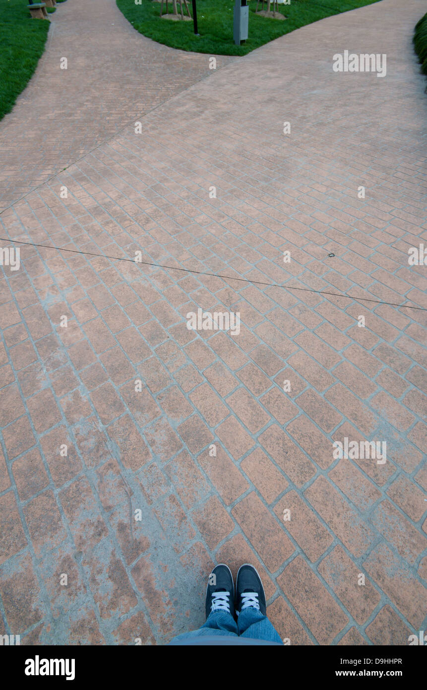 Walking on a merging path Stock Photo - Alamy