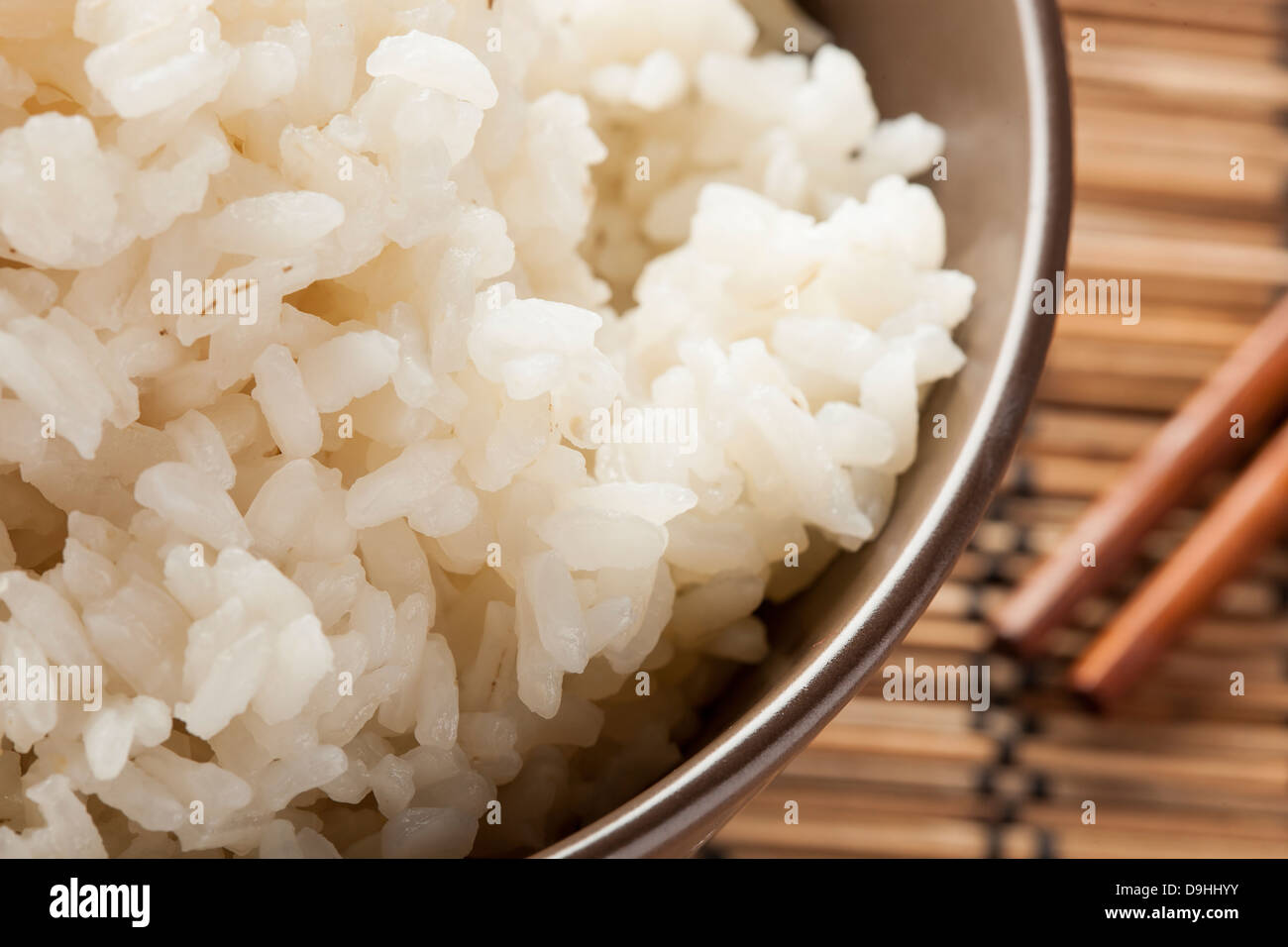 Bowl of Organic White Rice with chop sticks Stock Photo - Alamy