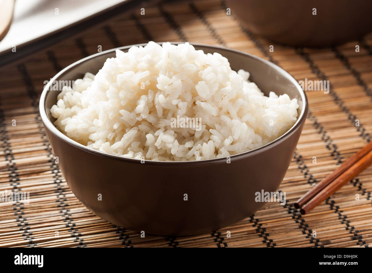 Bowl of Organic White Rice with chop sticks Stock Photo - Alamy
