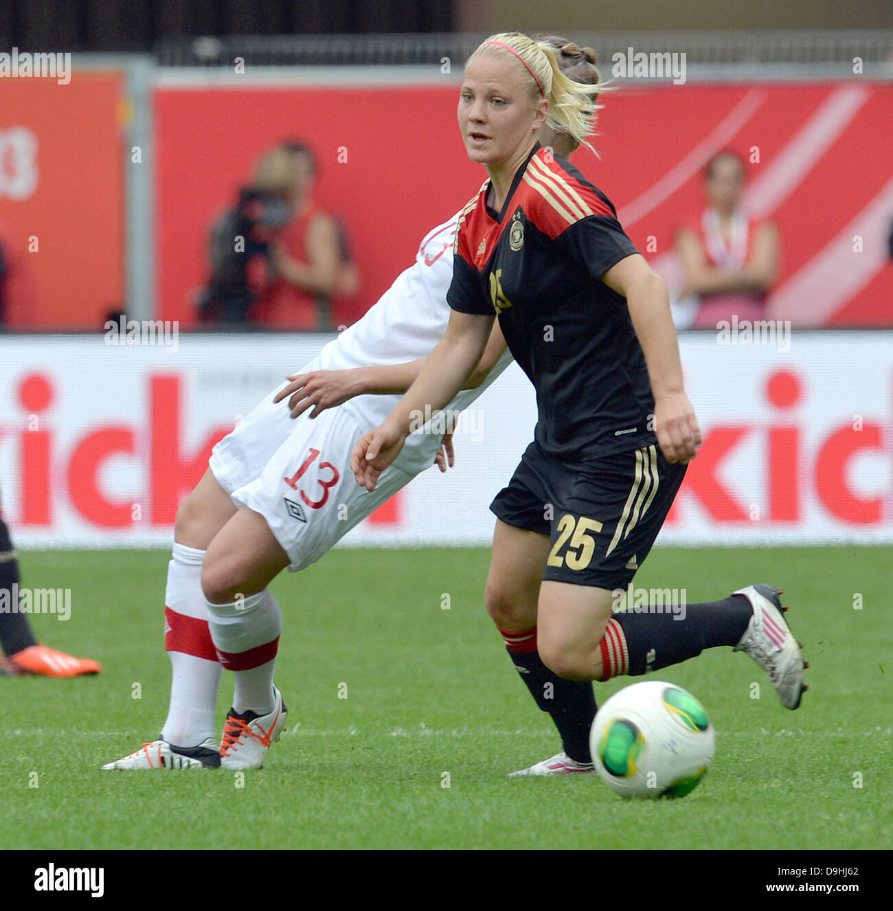 Germany's Leonie Maier (R) and Canada's Sophie Schmidt vie for the ball ...