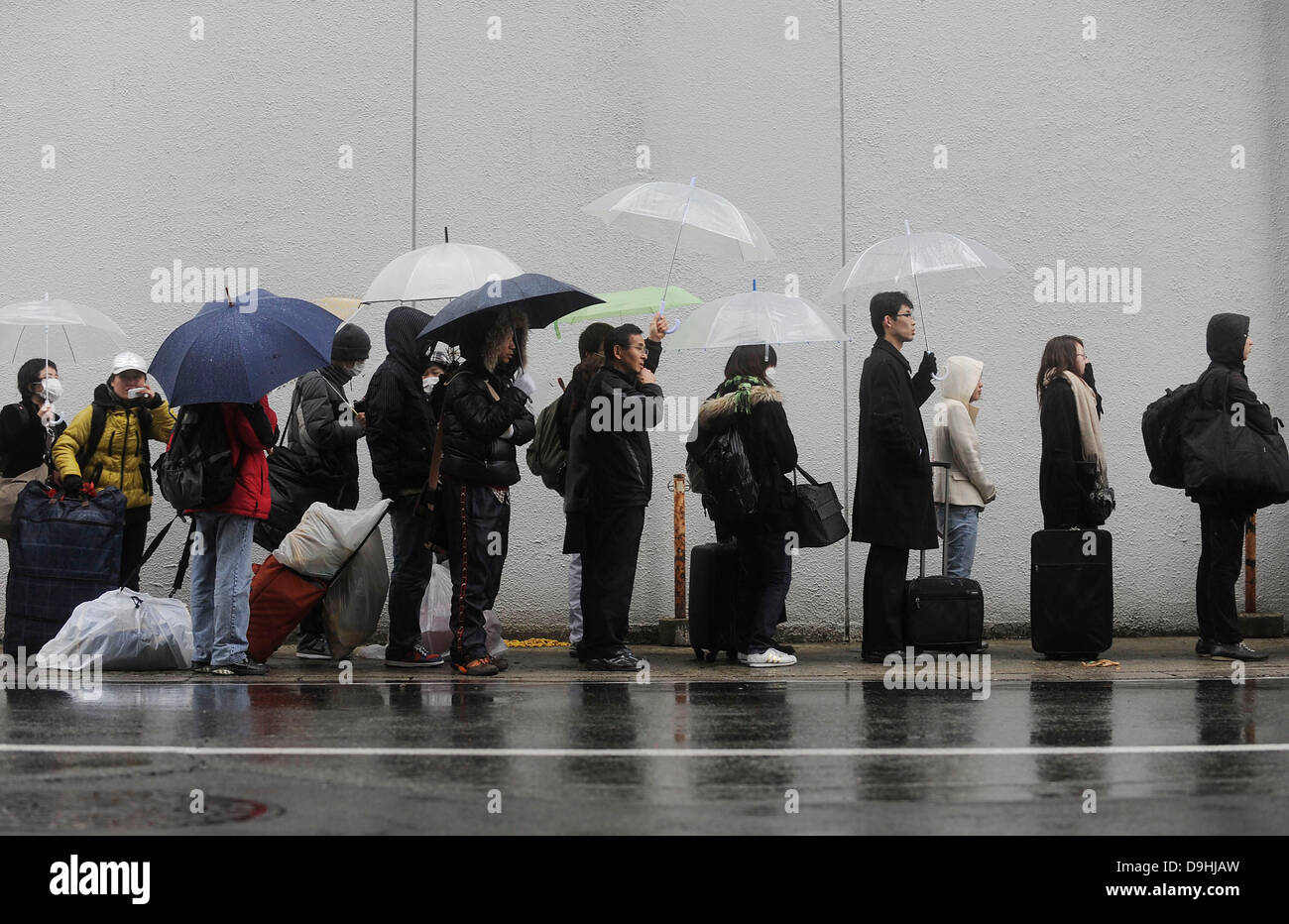 People wait for buses at an intercity bus station in Yamagata city of ...