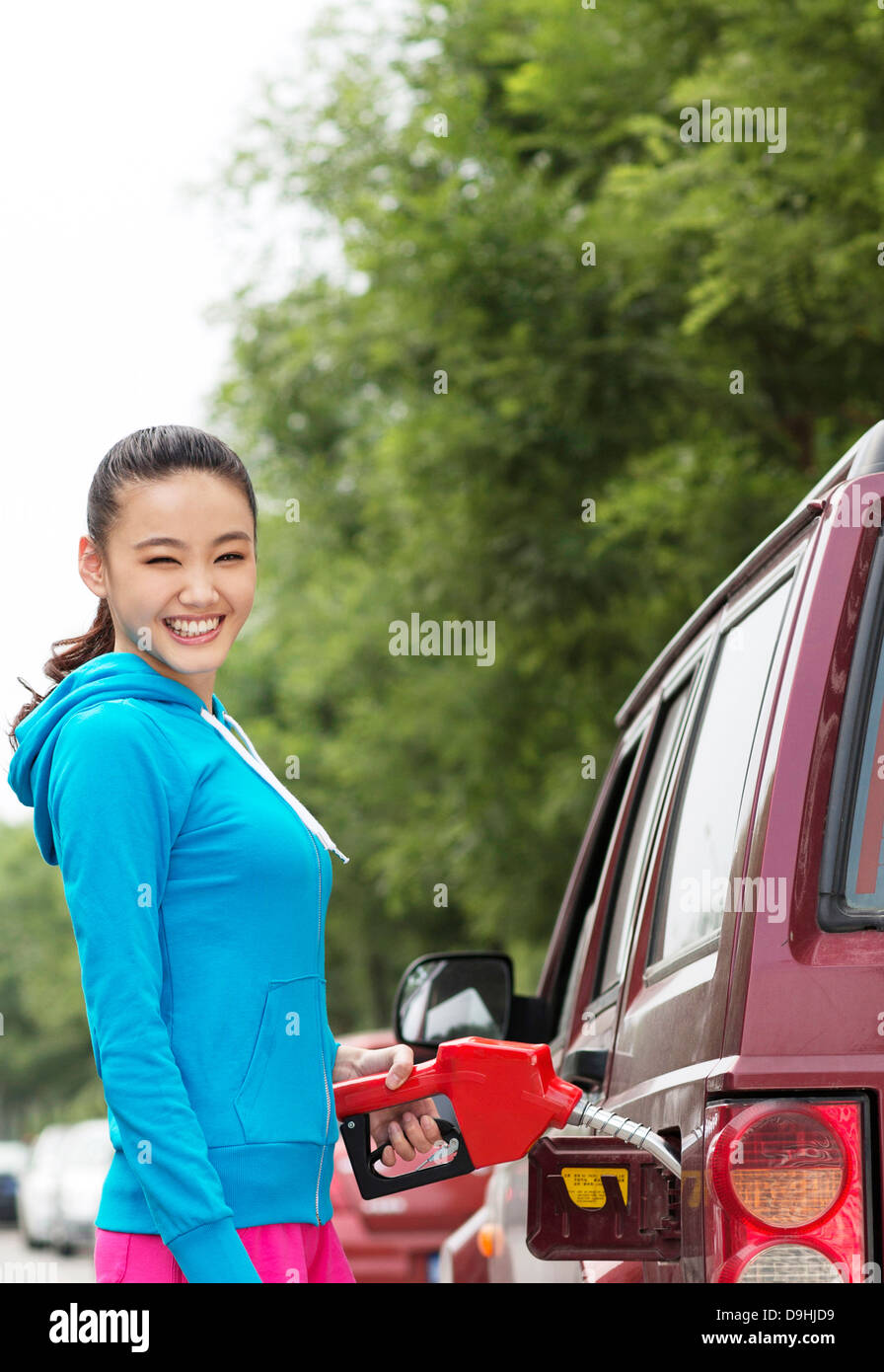 Woman gas station looking at camera hi-res stock photography and images ...