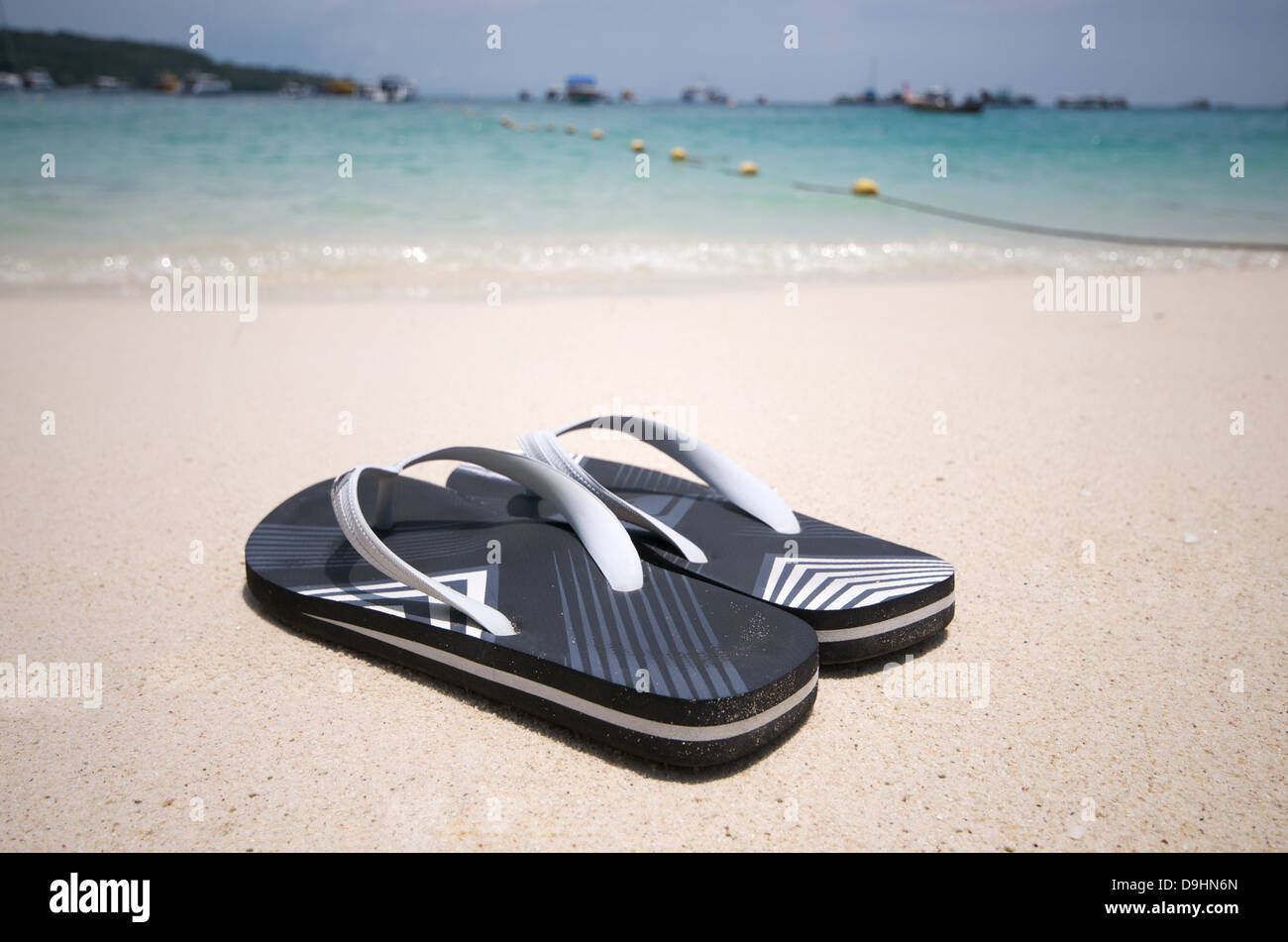 A pair of sandals on the beach Stock Photo - Alamy