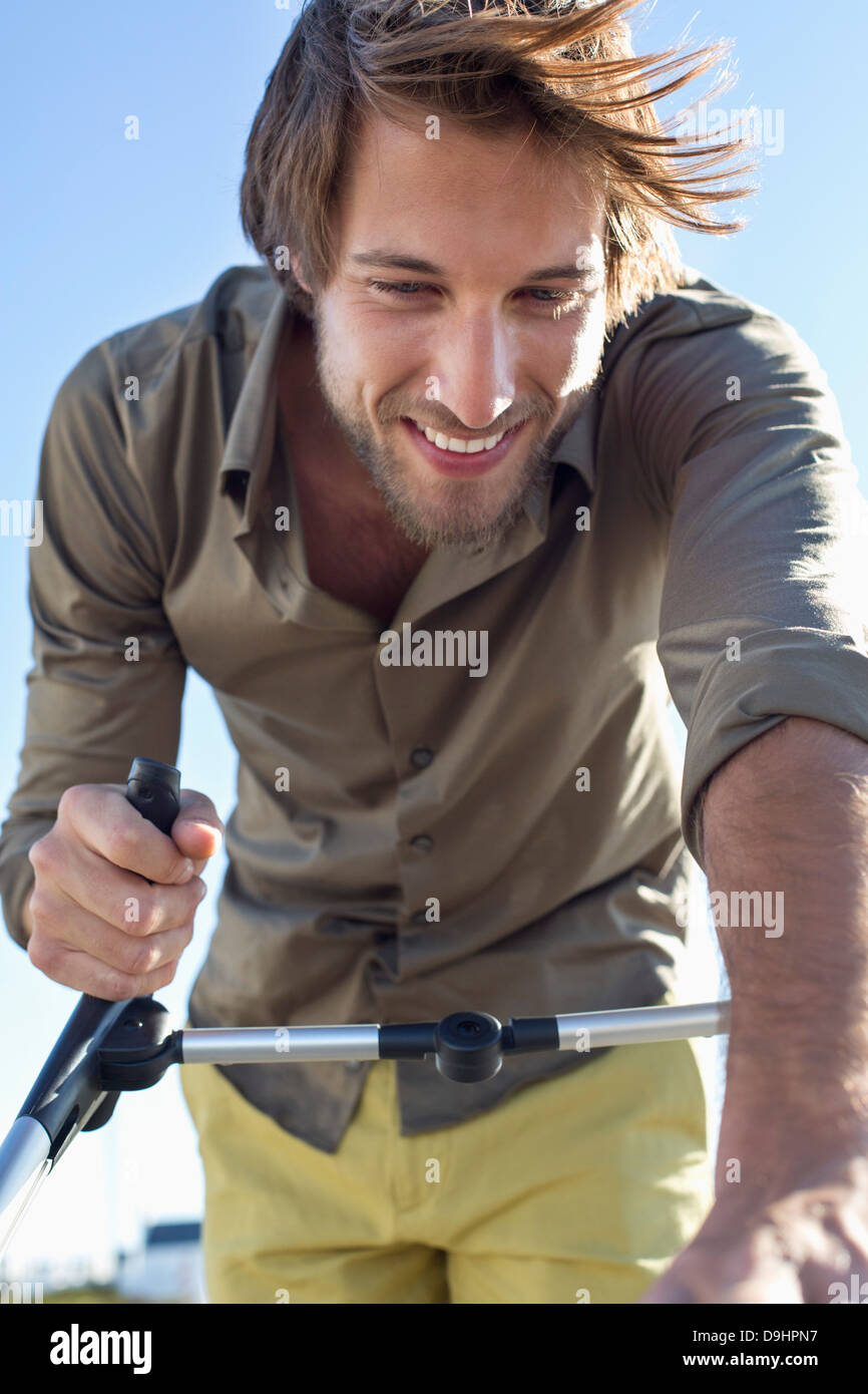 Man playing with baby in stroller Stock Photo - Alamy