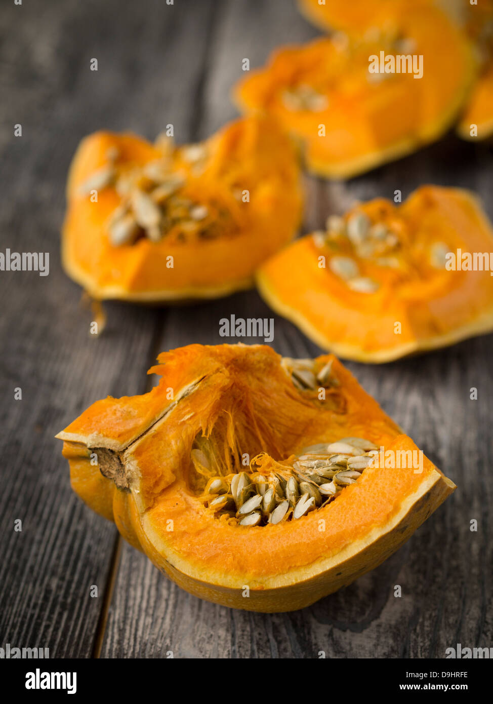 Raw pumpkin on a wooden table Stock Photo - Alamy