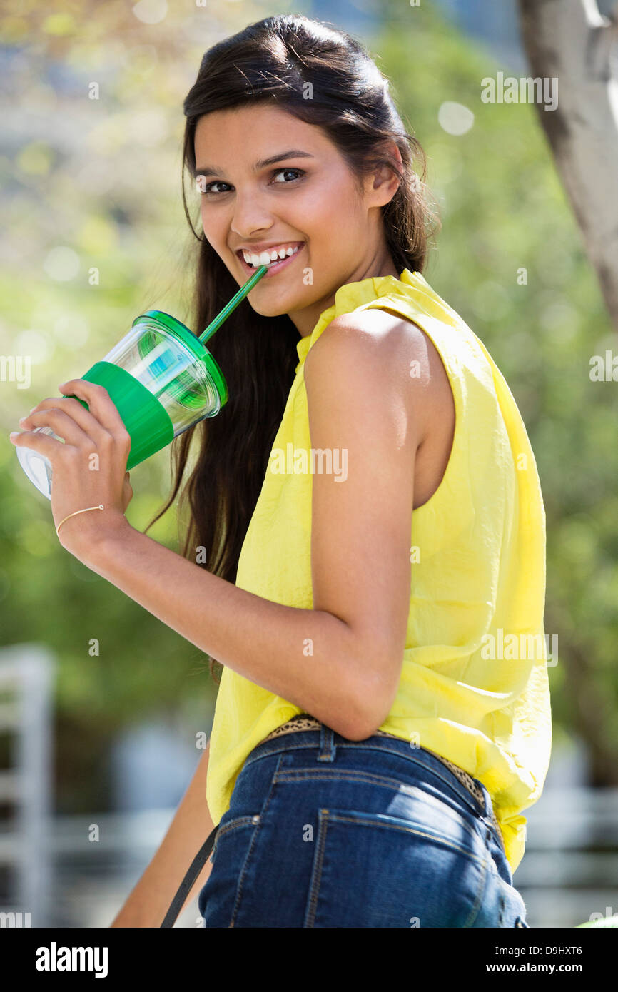Portrait of a woman drinking Stock Photo - Alamy
