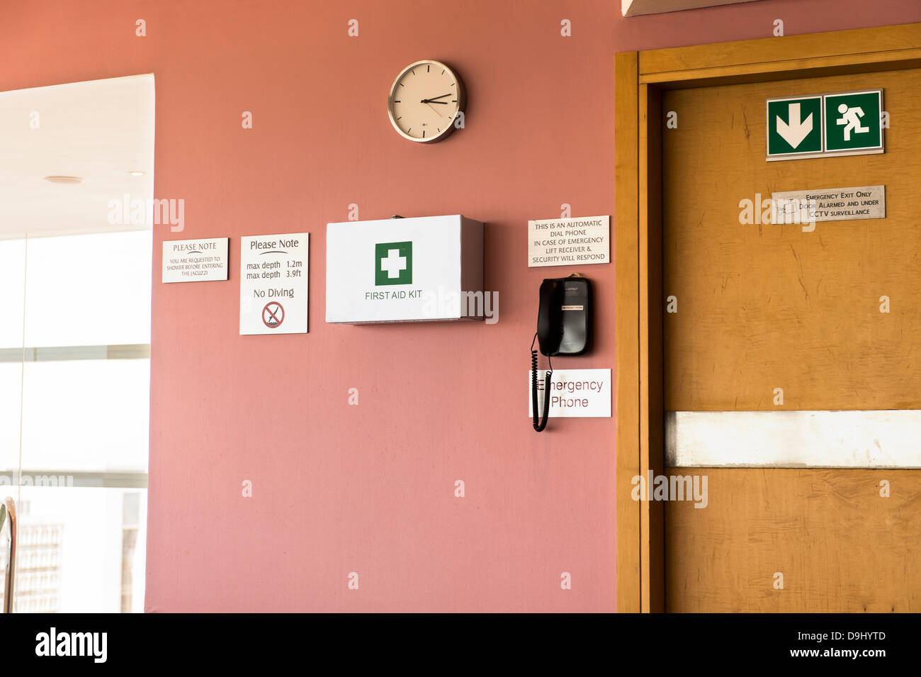 Emergency exit door with first aid kit and emergency phone Stock Photo ...