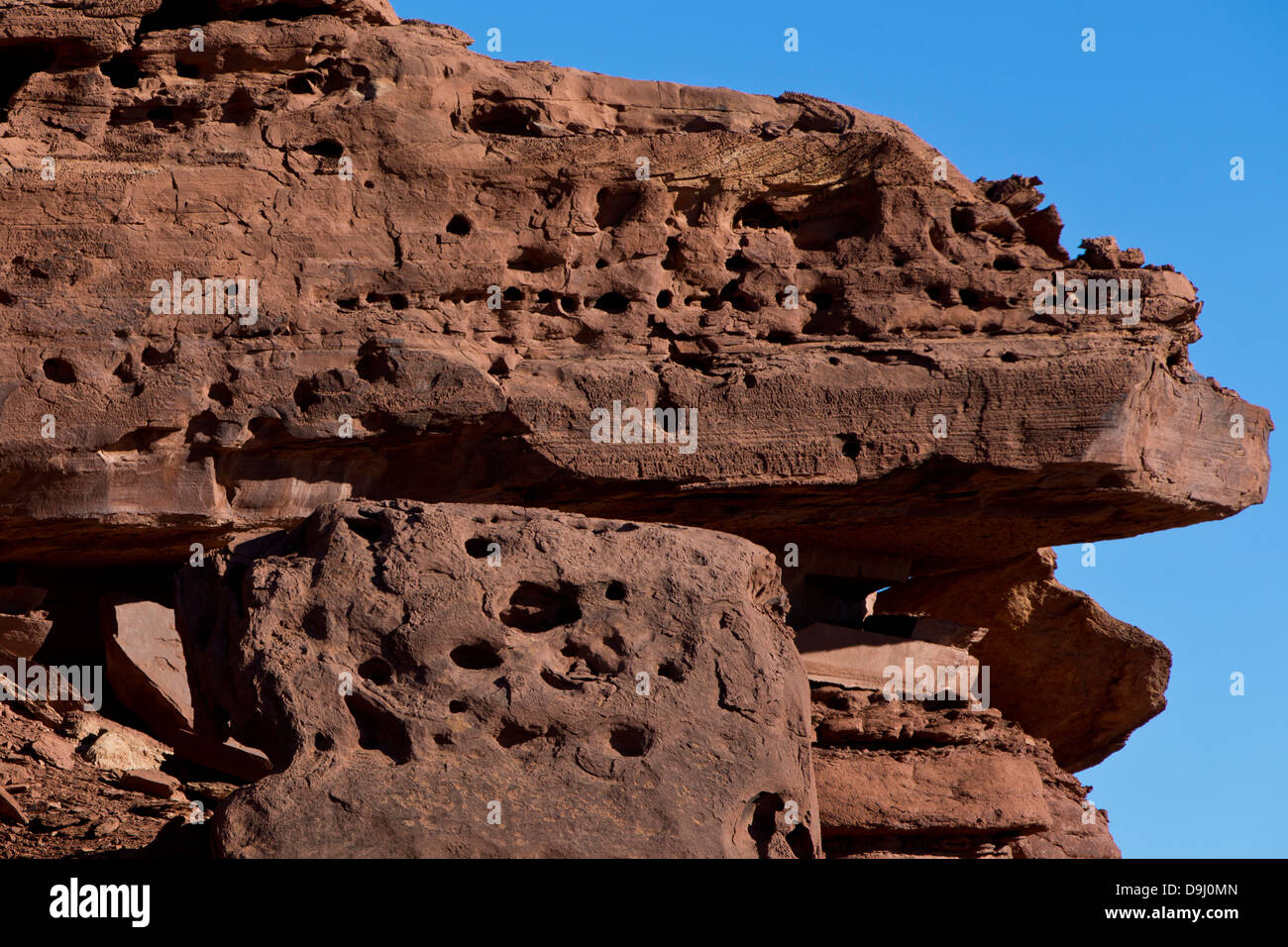 Sandstone cliff wall with holes, Capitol Reef National Park, Utah ...
