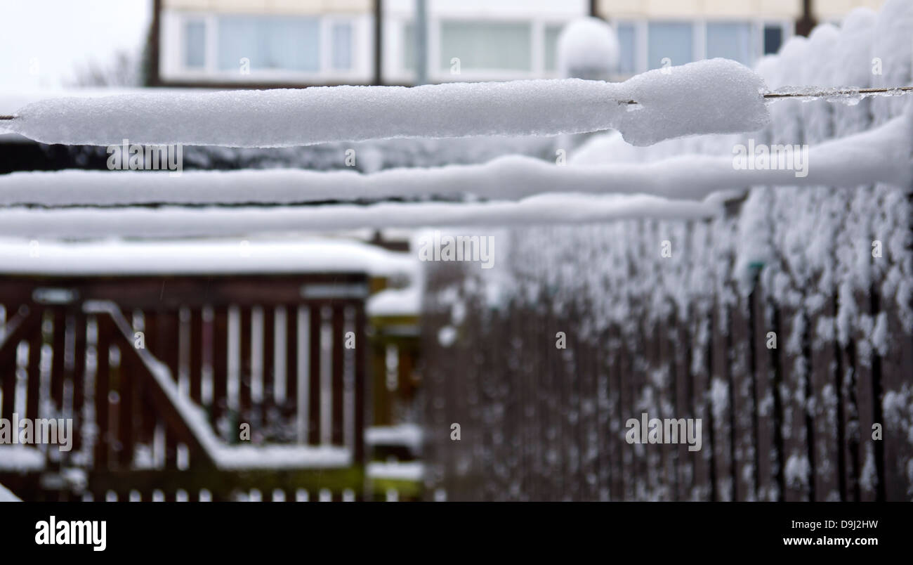 Washing line frozen with snow Stock Photo - Alamy