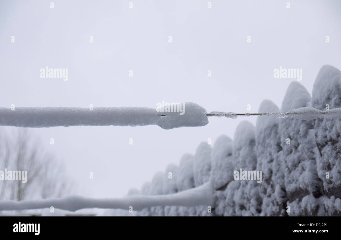 Washing line frozen with snow Stock Photo - Alamy