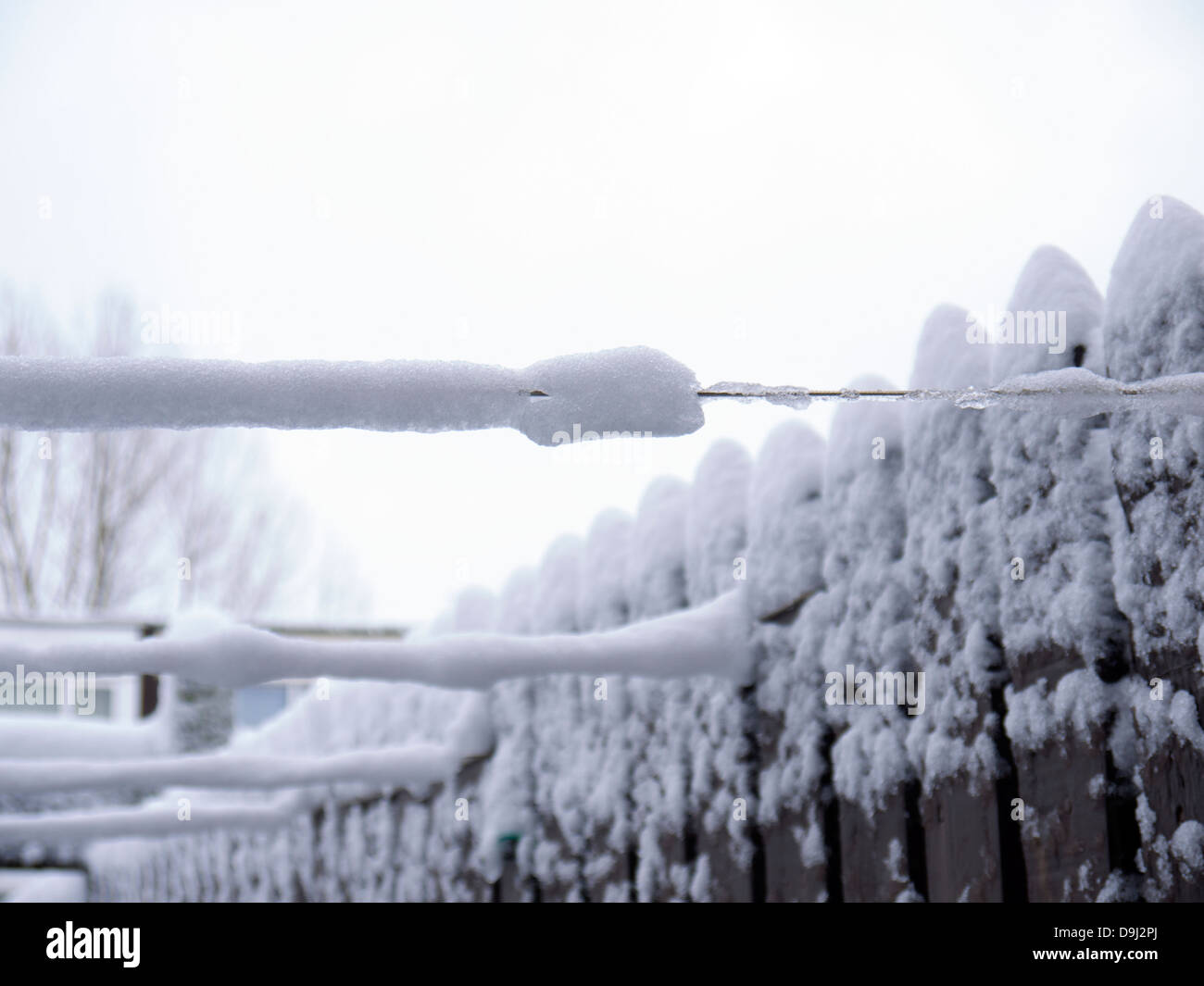 Washing line frozen with snow Stock Photo - Alamy