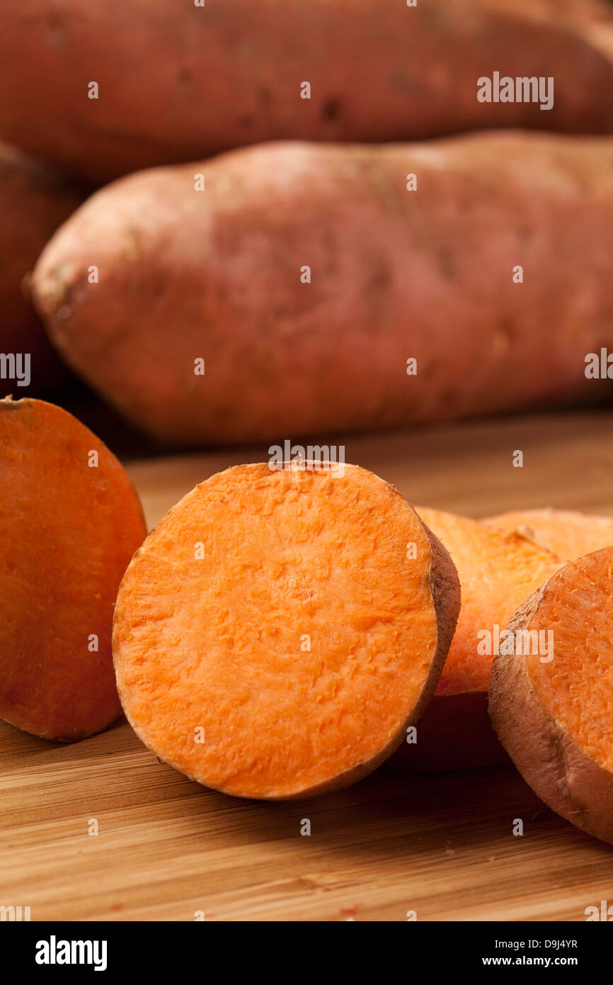 Fresh Organic Orange Sweet Potato against a background Stock Photo - Alamy