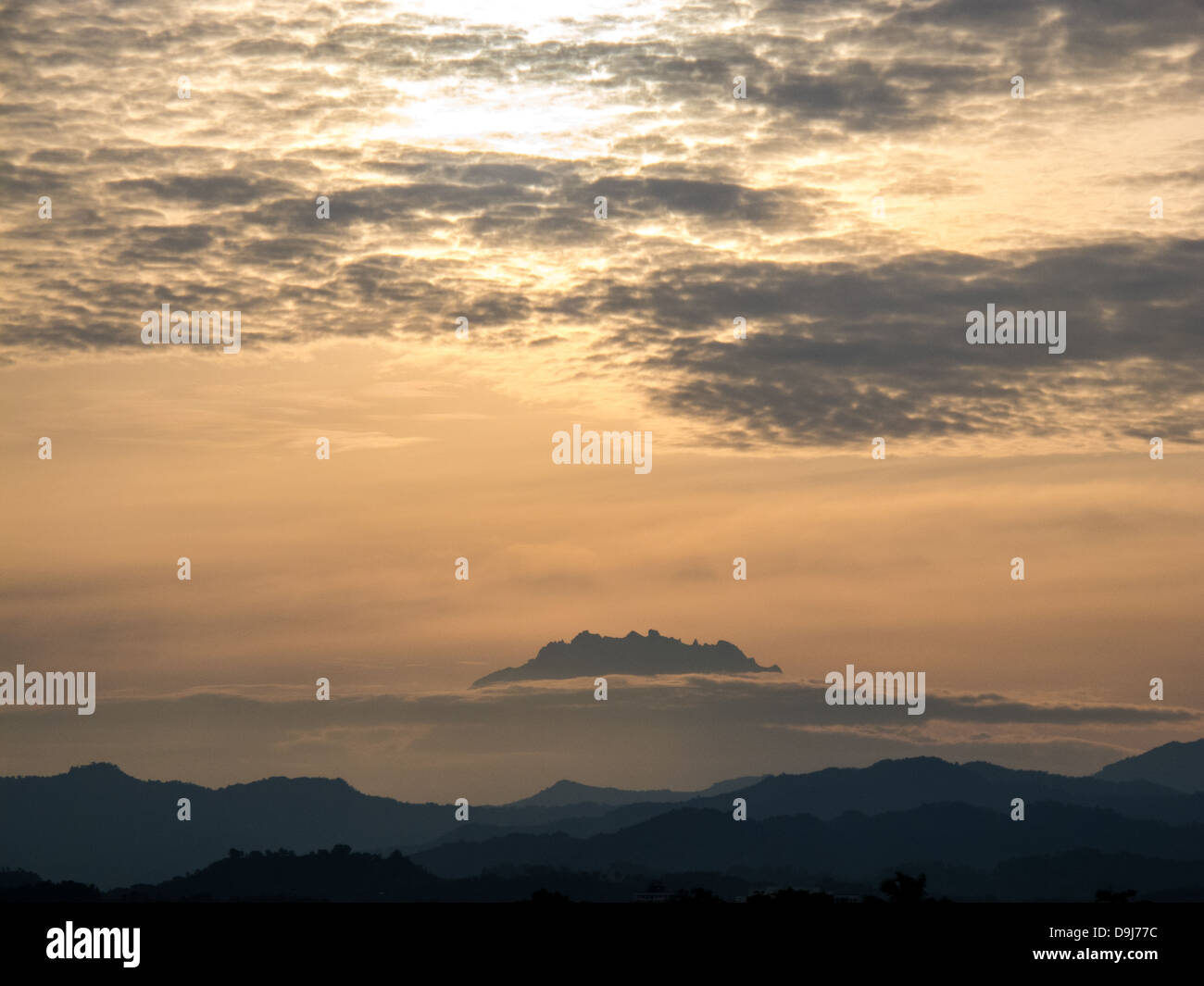 sunset over Mount Kinabalu mountain in Sabah on the island of Borneo ...