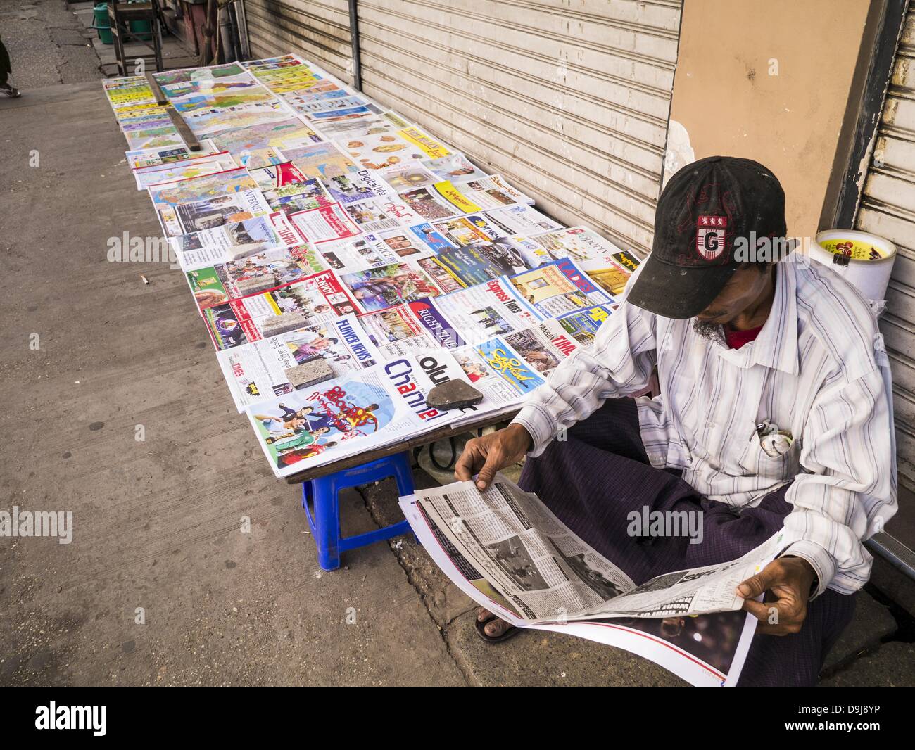 June 17, 2013 - Yangon, Union of Myanmar - A newspaper vendor in Yangon ...