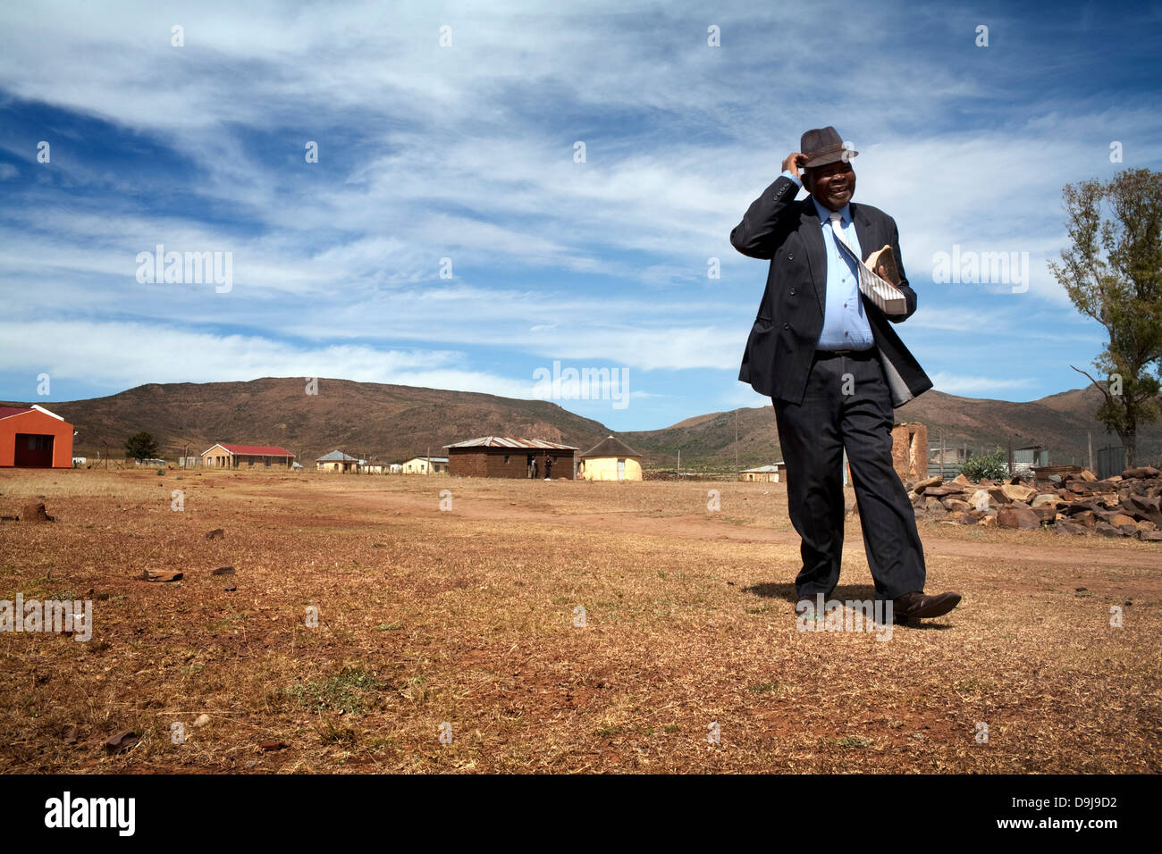 An elderly Xhosa man walks to church in Bolothowa Village, Transkei ...