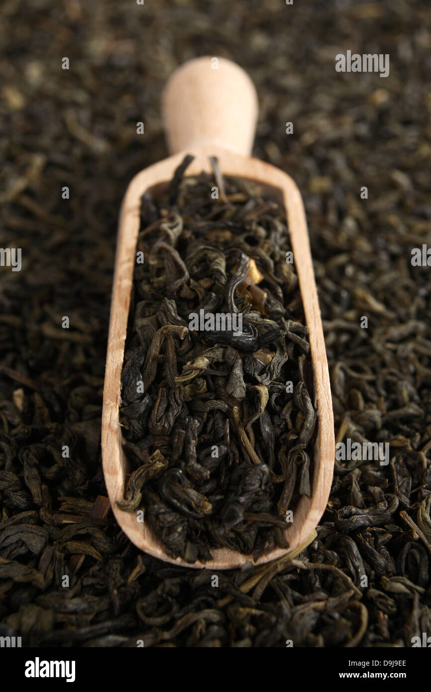 Tea mixture with wooden shovel Stock Photo - Alamy