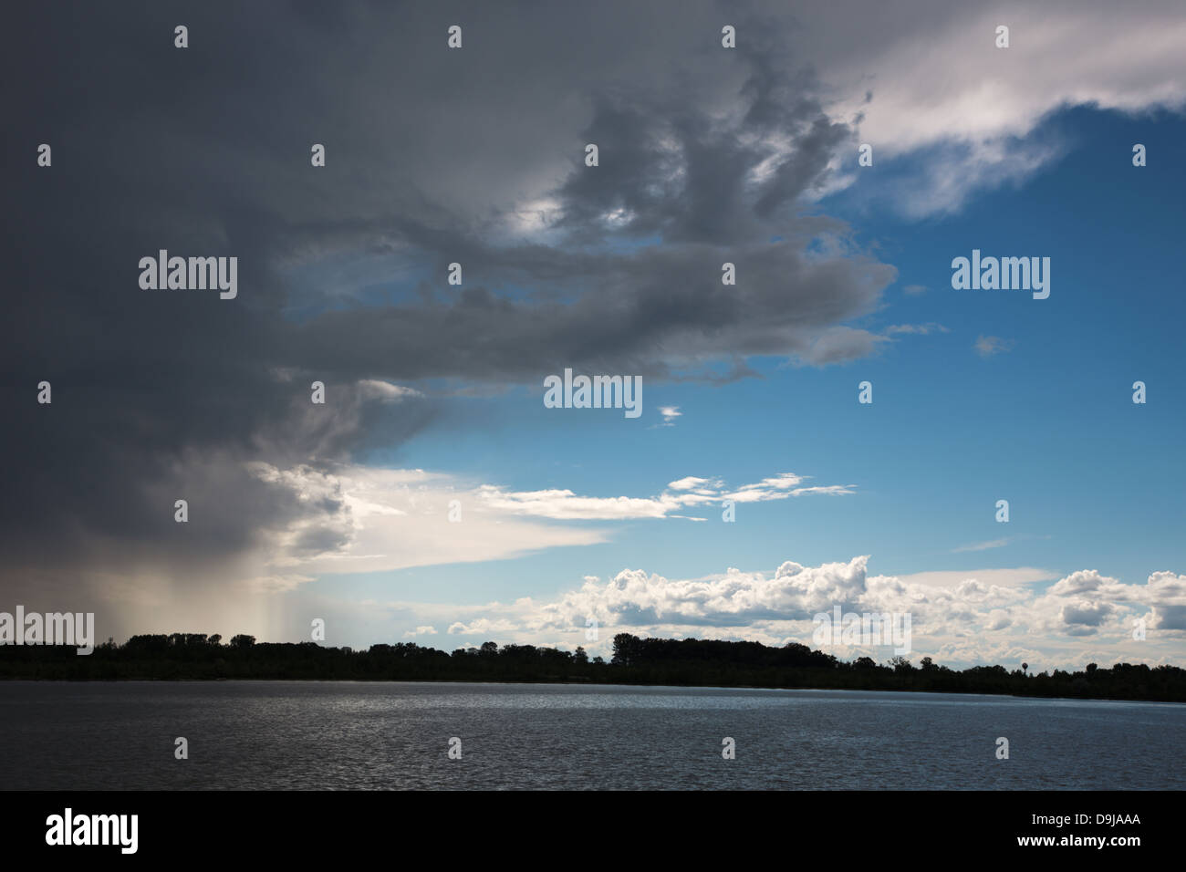 summer storm over lake Stock Photo - Alamy