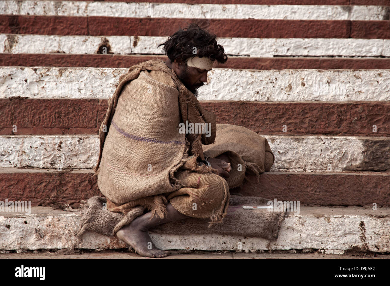 Indian man on steps varanasi india hi-res stock photography and images ...