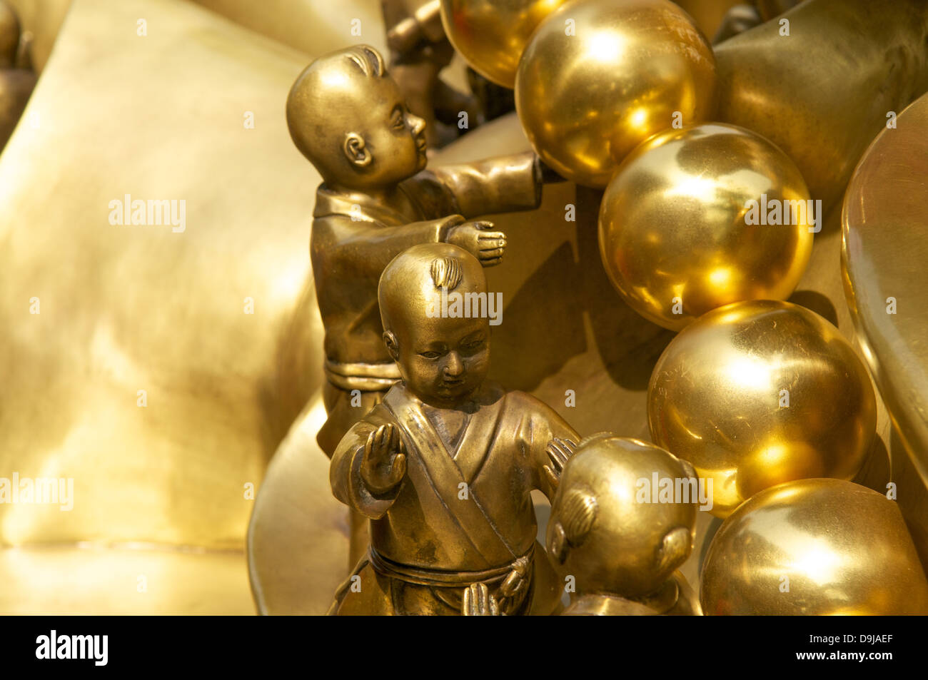 Golden monks in Da Nam Temple in Vietnam Stock Photo - Alamy