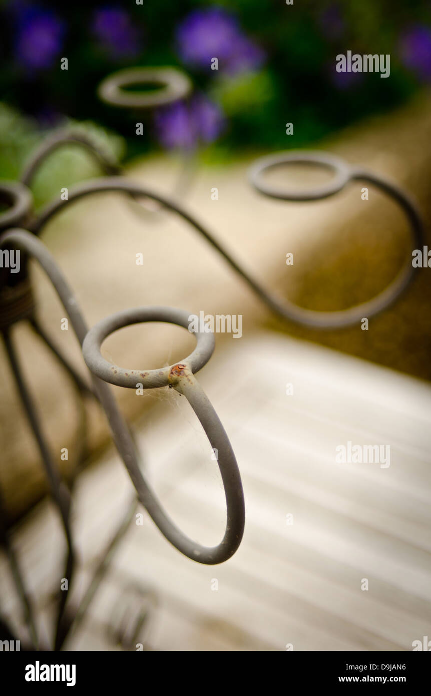 Rusty candelabra candle holder in a garden Stock Photo - Alamy