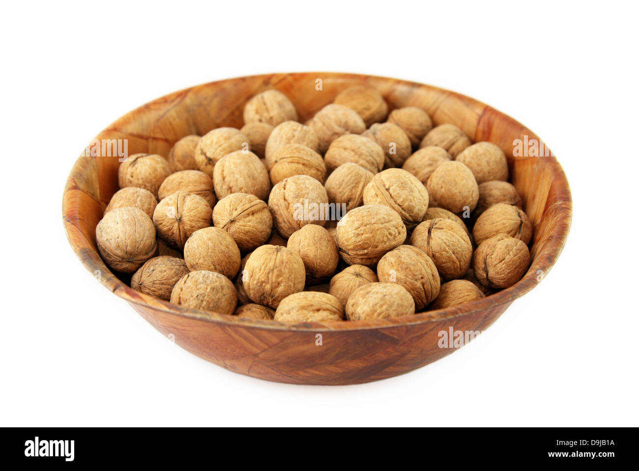 Bowl filled with nuts isolated on white Stock Photo - Alamy