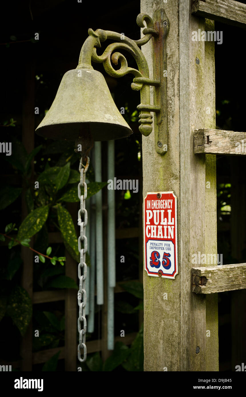 Decorative Hand rung bell in garden with emergency pull chain sign ...