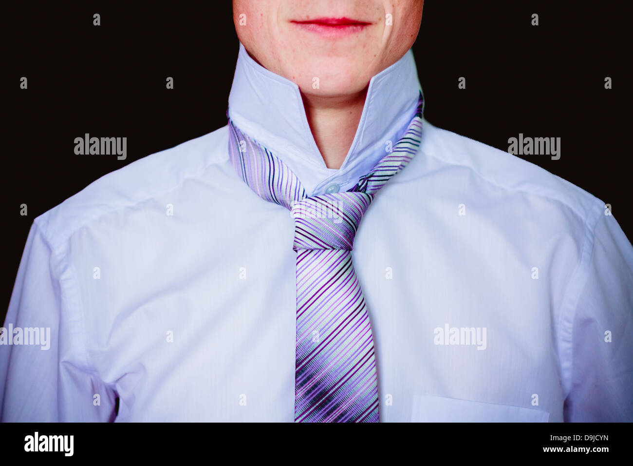 Closeup of business man tying a tie Stock Photo - Alamy