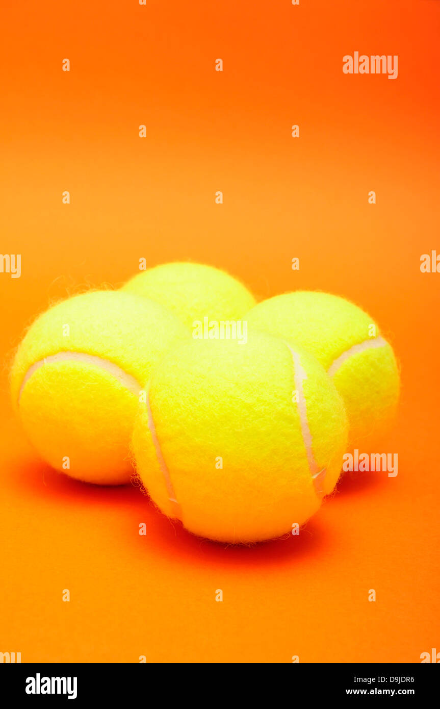 four yellow tennis balls Stock Photo - Alamy