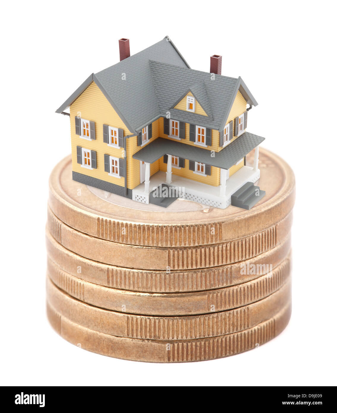 Miniature house and euro coins Cut Out Stock Images & Pictures - Alamy