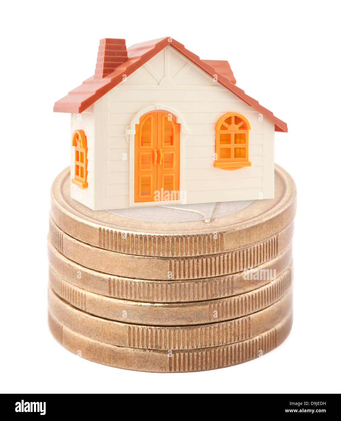 Toy house on stack of euro coins Stock Photo - Alamy