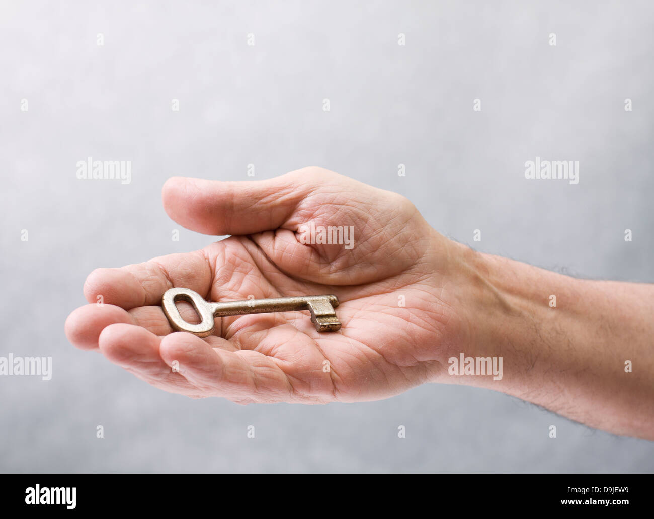 Key in hand Stock Photo - Alamy