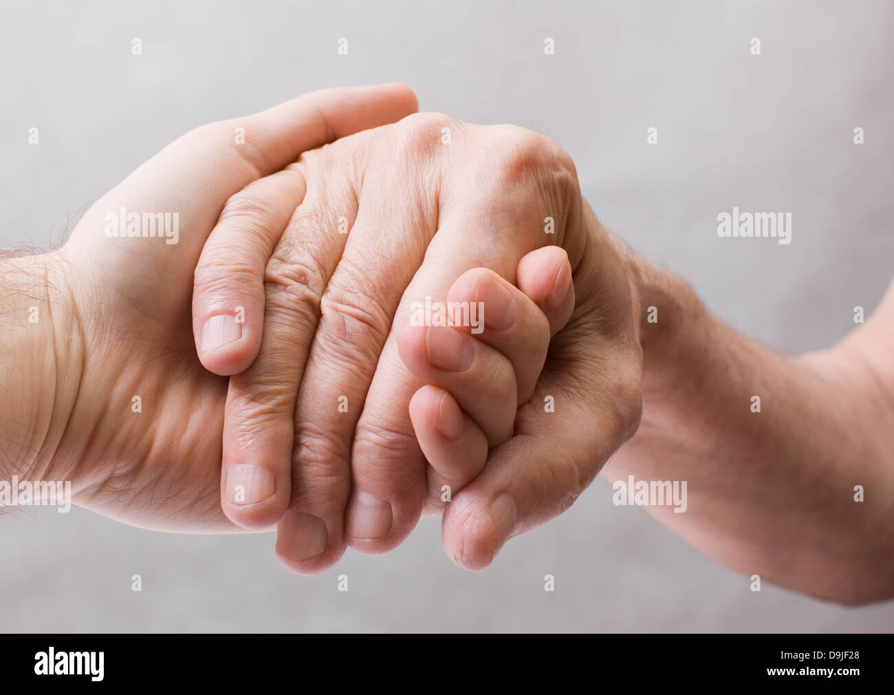 Aiding hands hi-res stock photography and images - Alamy