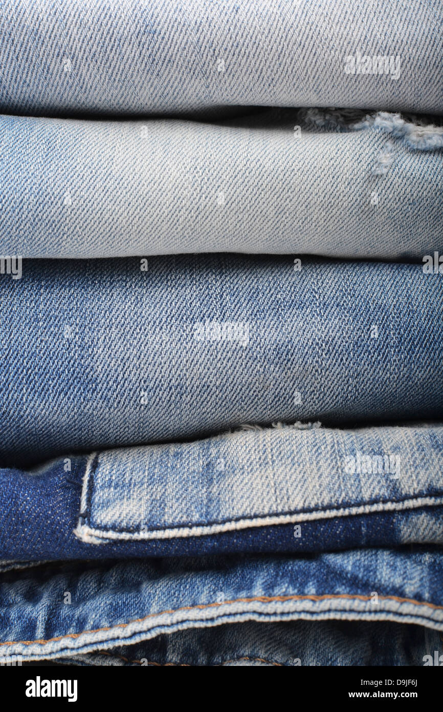 Stack of folded jeans Stock Photo - Alamy